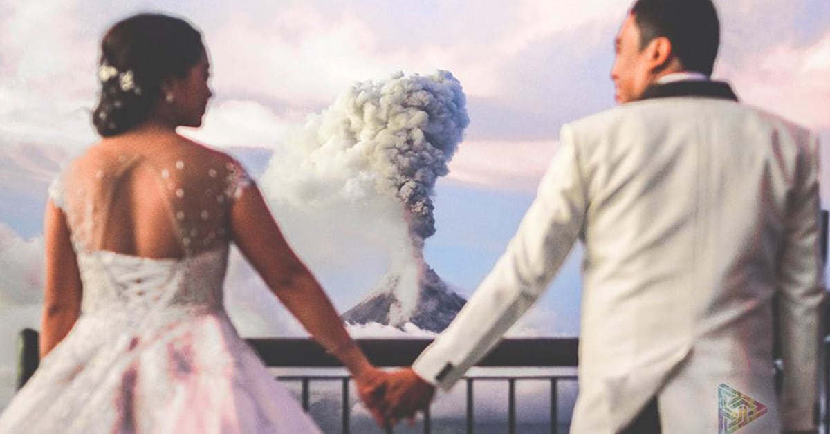 Newlyweds Pose for Romantic Wedding Photos in Front of an Erupting ...